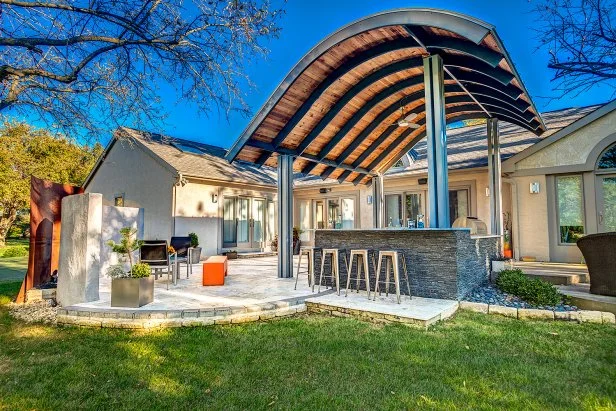 Patio With Modern Steel Roof and Outdoor Fireplace | HGTV Ultimate ...