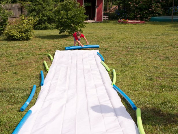 DIY Slip and Slide: How to Make a Backyard Water Slide | HGTV