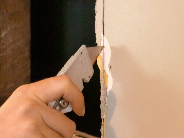 How to Fix Holes in Drywall | Patch a Hole in Drywall | HGTV