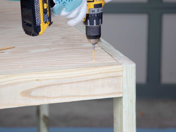 DIY Two-Tiered Garage Storage Stand With Ramp | HGTV