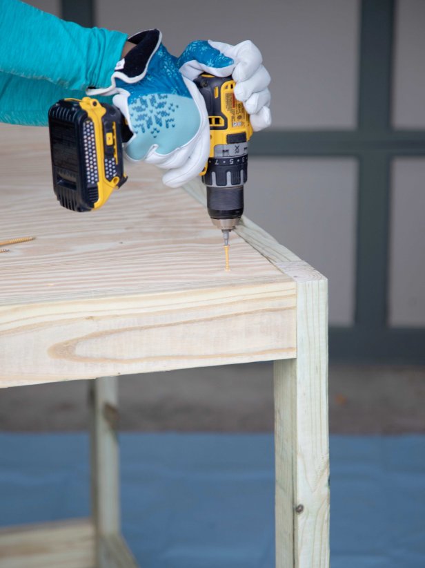 DIY Two-Tiered Garage Storage Stand With Ramp | HGTV