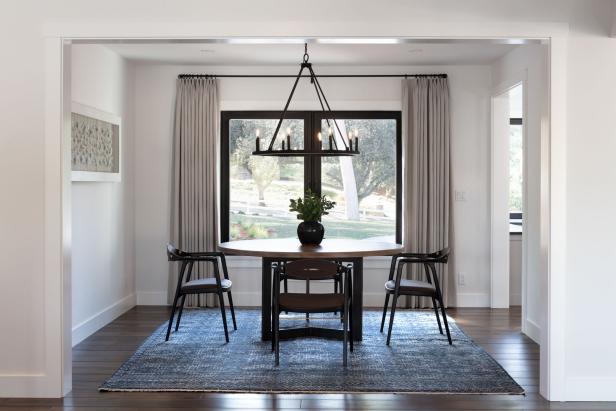 Formal Dining Room With Picture Windows and a Circular Table | HGTV